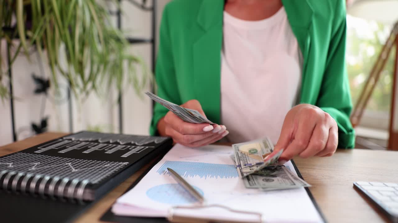 Counting money in the office | Premium Stock Video Footage