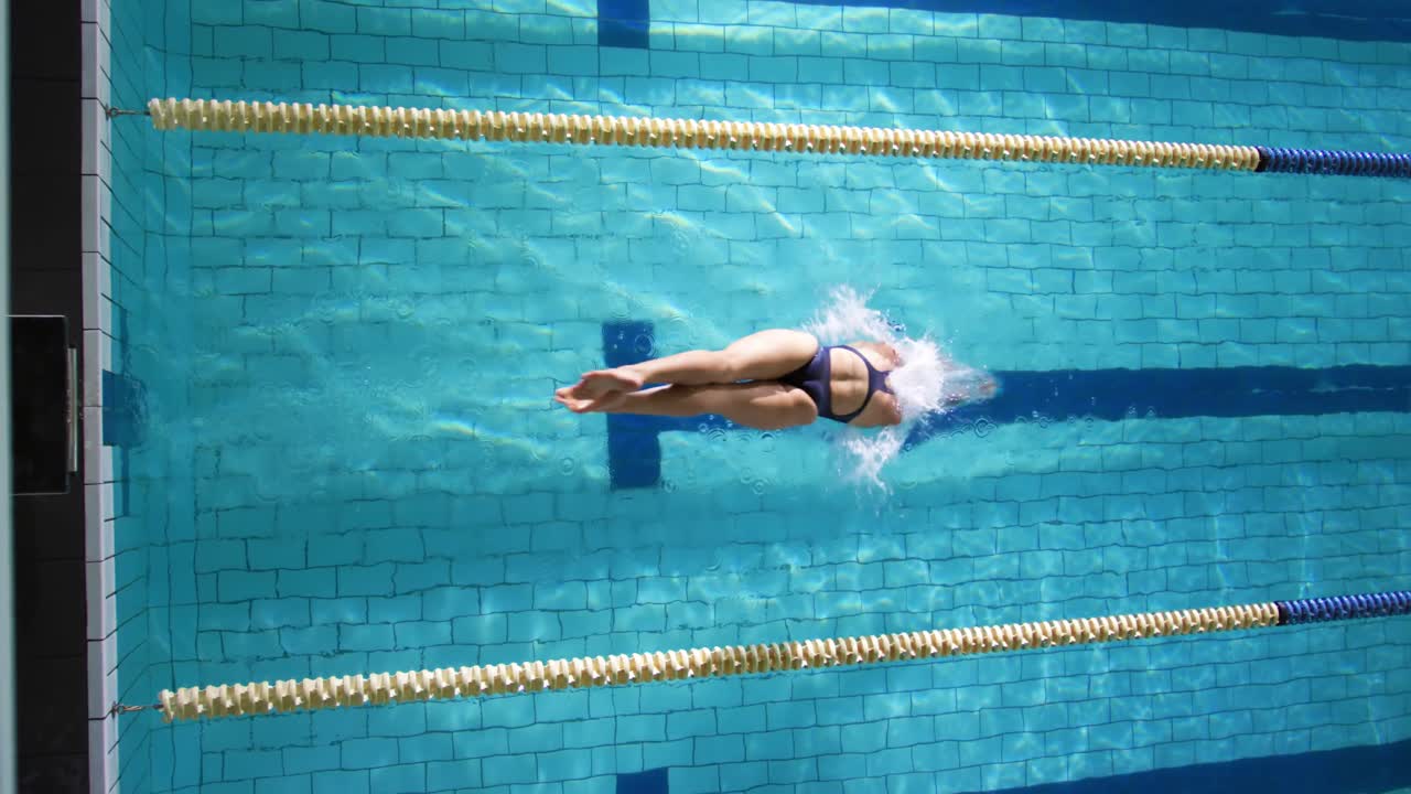 Premium stock video - Swimmer training in a swimming pool
