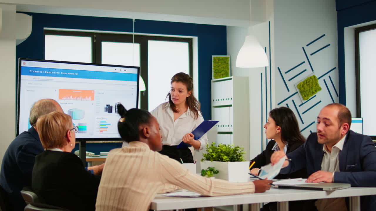 Premium stock video - Manager executive pointing at digital interactive ...