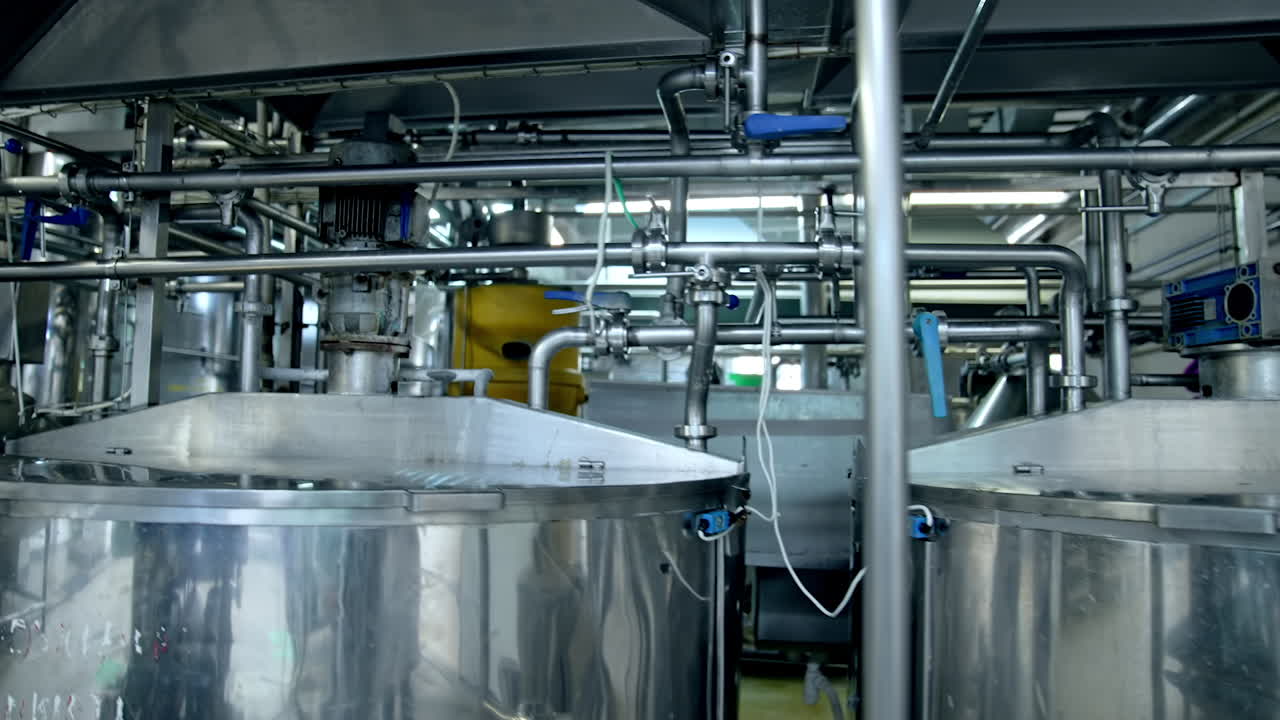 Stainless cheese factory storages. Modern cheesemaking technologies ...