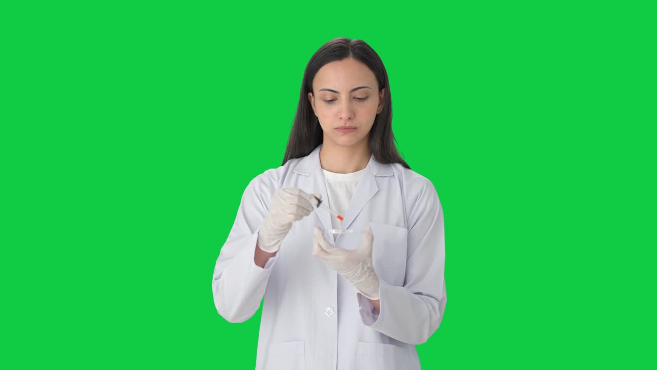 Premium stock video - Indian female scientist doing experiments green ...