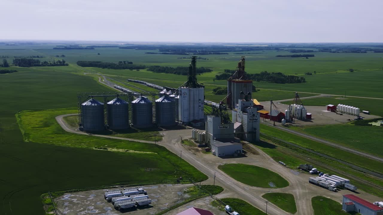 A Series Of Large Industrial Agricultural Grain Elevator Bins On Land ...