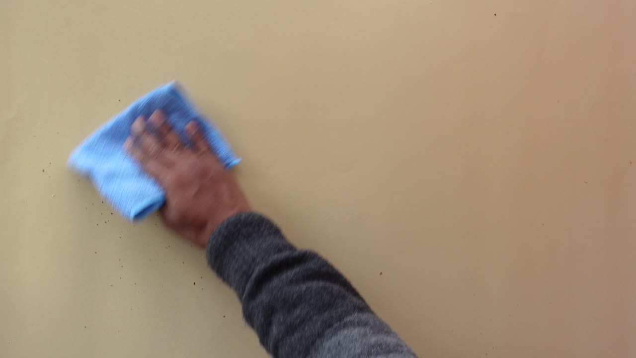 Cleaning up a mess with a cloth Premium Stock Video Footage