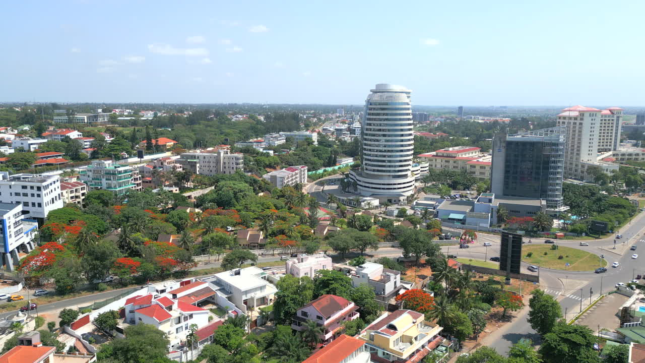 Aerial establishing shot of modern Rani Towers in Maputo Downtown ...