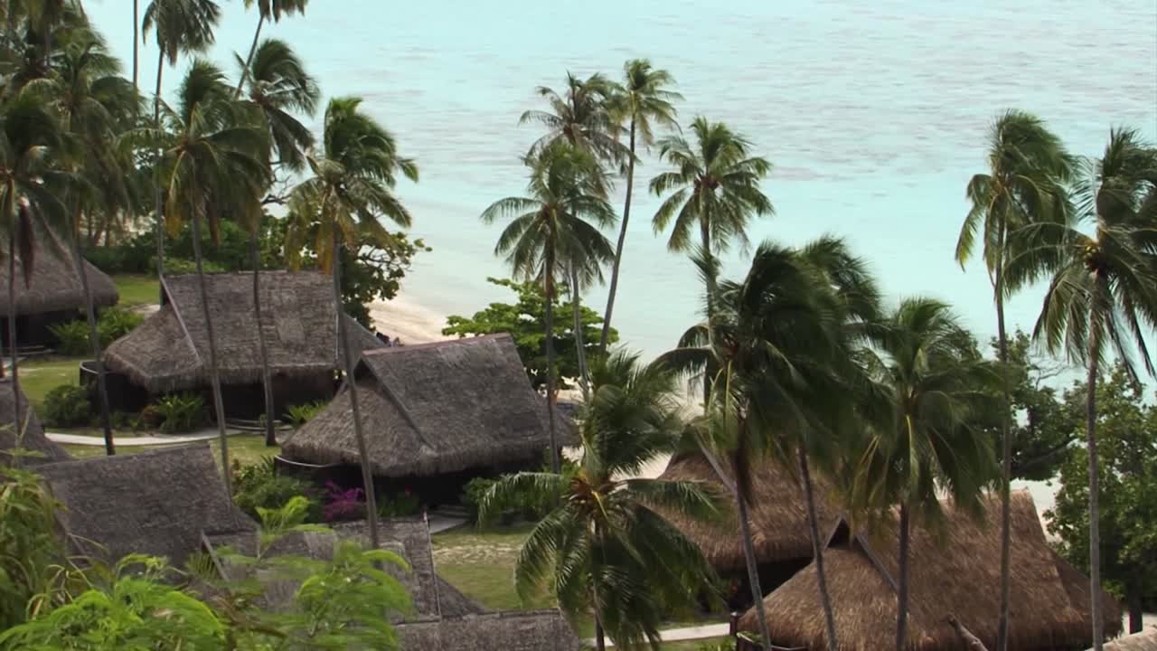 Premium stock video - Wooden houses for rent by the beach in moorea ...