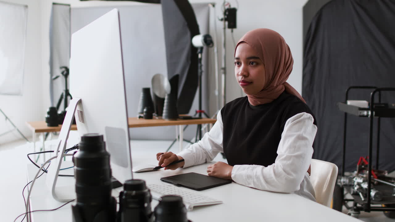 Free stock video - Photographer editing pictures