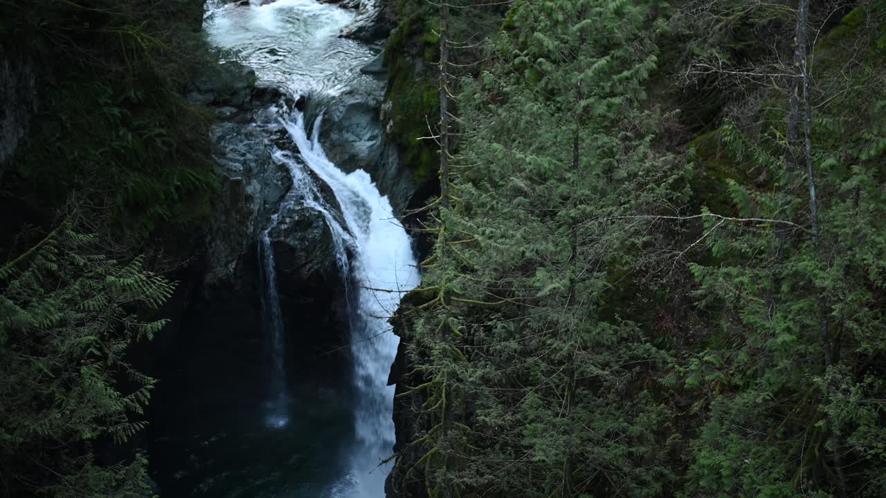 Cinematic Scene Of A Waterfall Within A Cliff In The Rainforest Of The ...