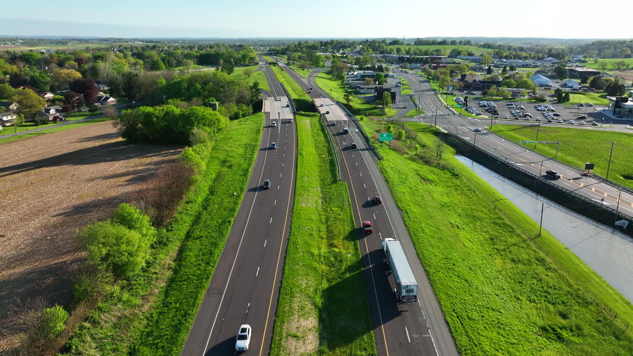 Aerial of divided highway through rural lancaster county farmland ...