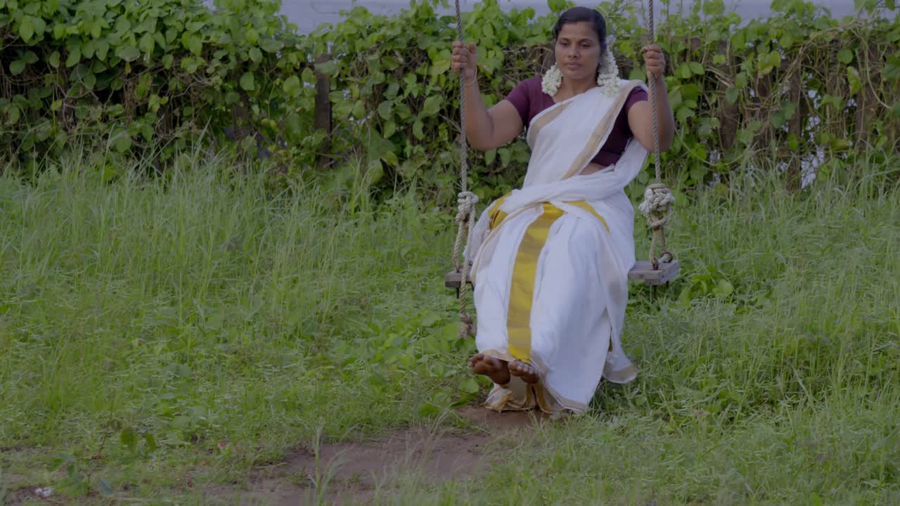 Onam traditional swing in Kerala called oonjal attam is traditional ...