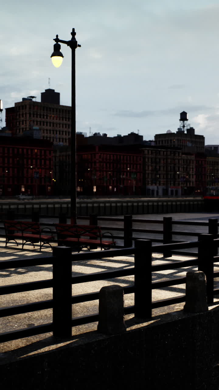 Premium stock video - A lone street light illuminates a waterfront park ...