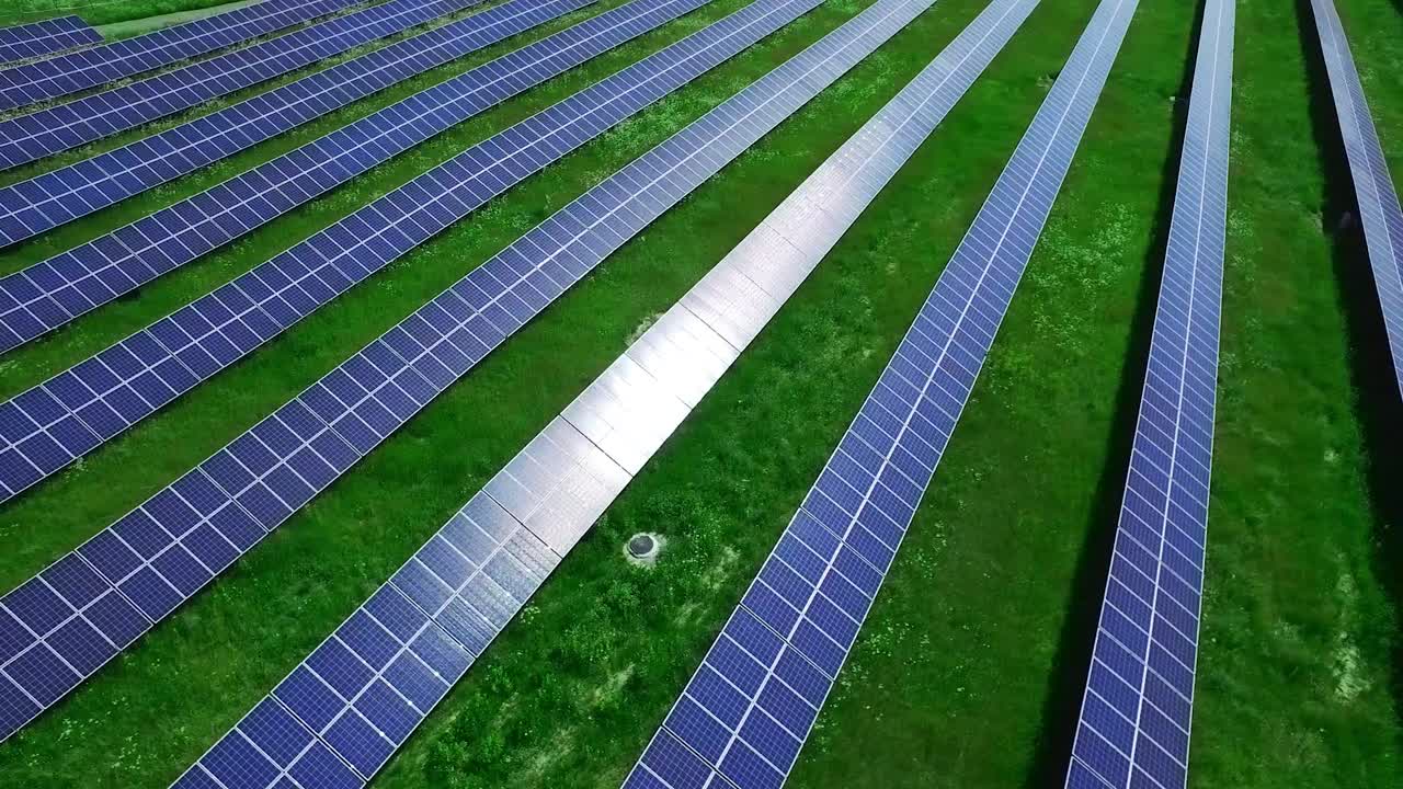 Photovoltaics modules in solar farm station. Aerial view of solar cells ...