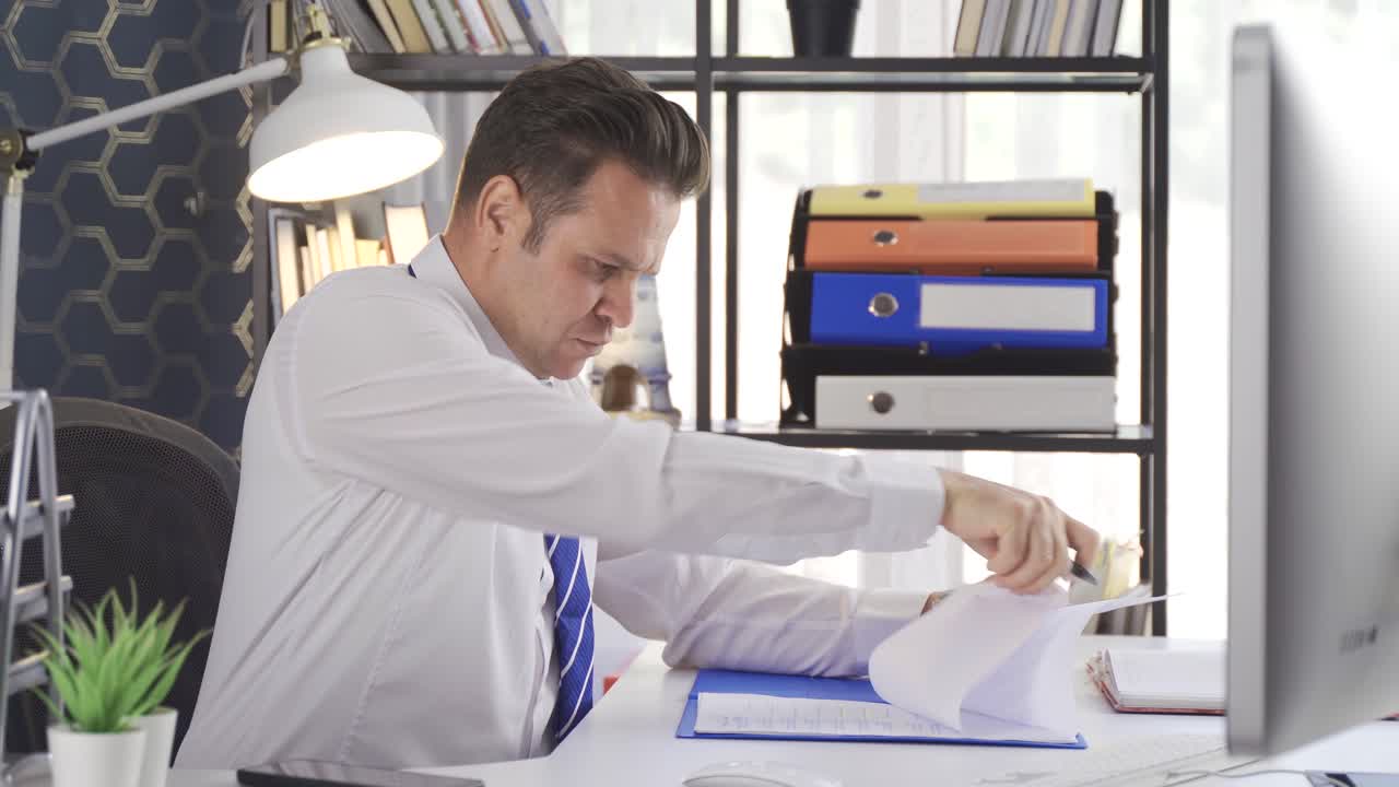 Office worker signs paperwork and necessary documents with pen ...