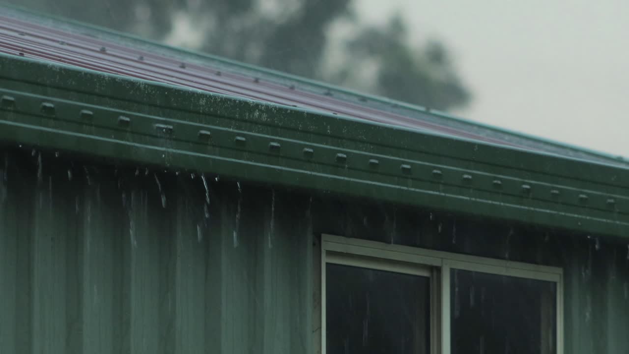 Premium stock video - Thunderstorm heavy rain on garage shed very windy ...