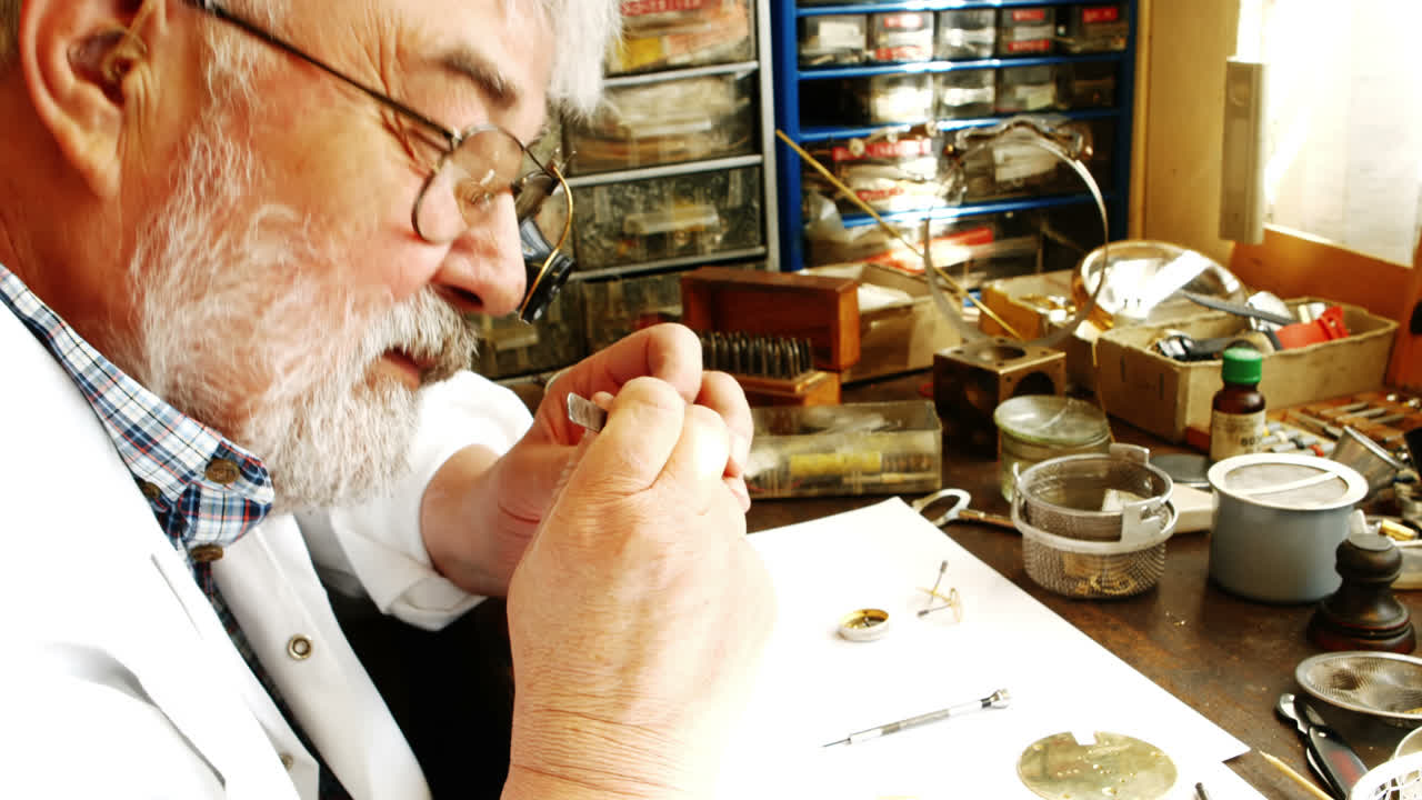 Horologist repairing a watch | Premium Stock Video Footage