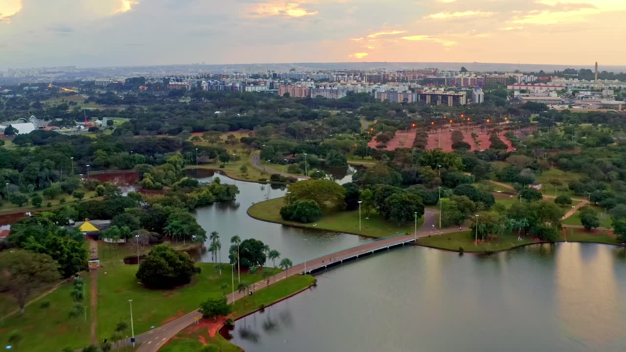 Premium stock video - Golden sunset over brasilia's park with waterways ...