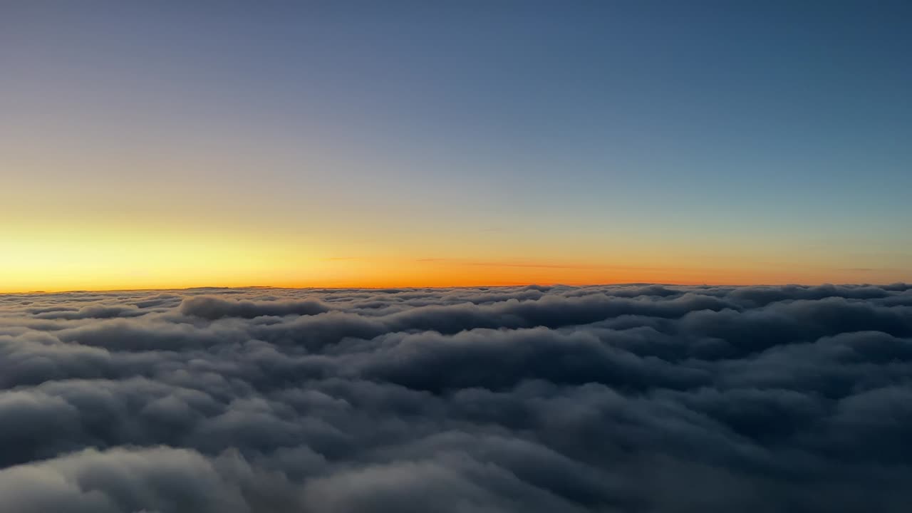 Sunset View From A Jet Cockpit Overflying Clouds With An Orange Horizon ...