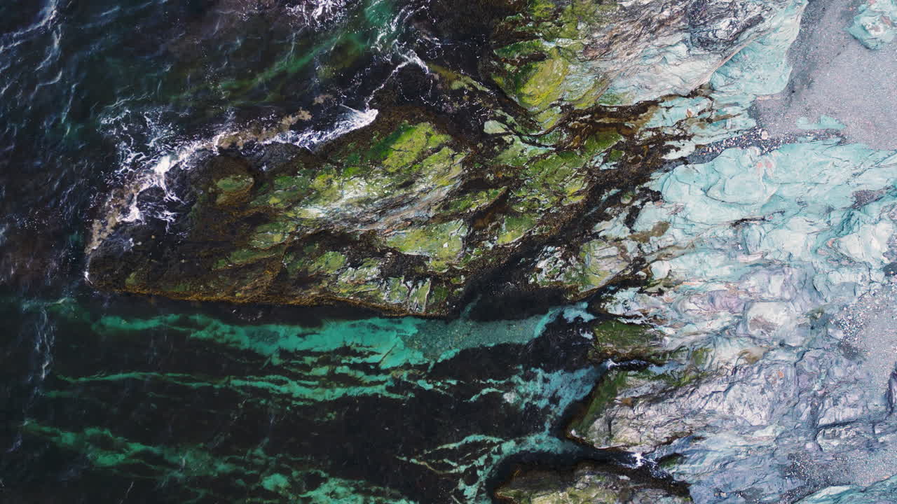 Premium stock video - Ocean waves crash from left to right across algae ...