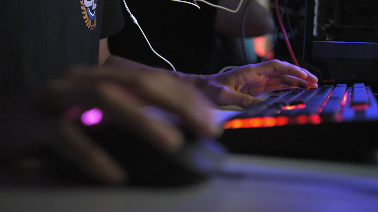 Premium stock video - Playing games on a computer at night