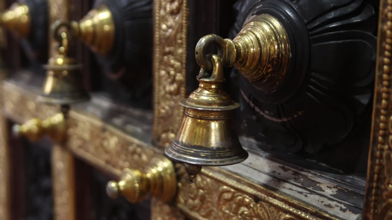 Premium stock video - Bells on the door of a hindu temple in the little ...