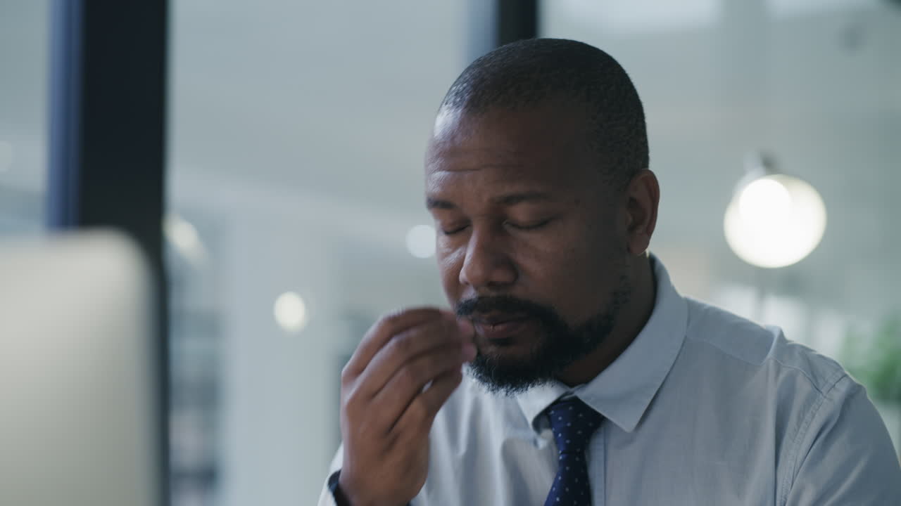 Premium stock video - 4k footage of a tired, stressed mature businessman