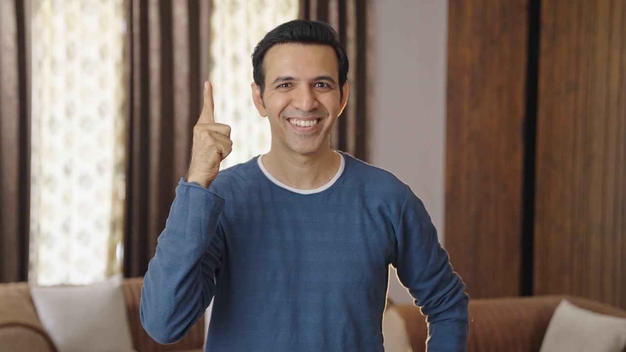 Premium stock video - Smart indian man gets an idea