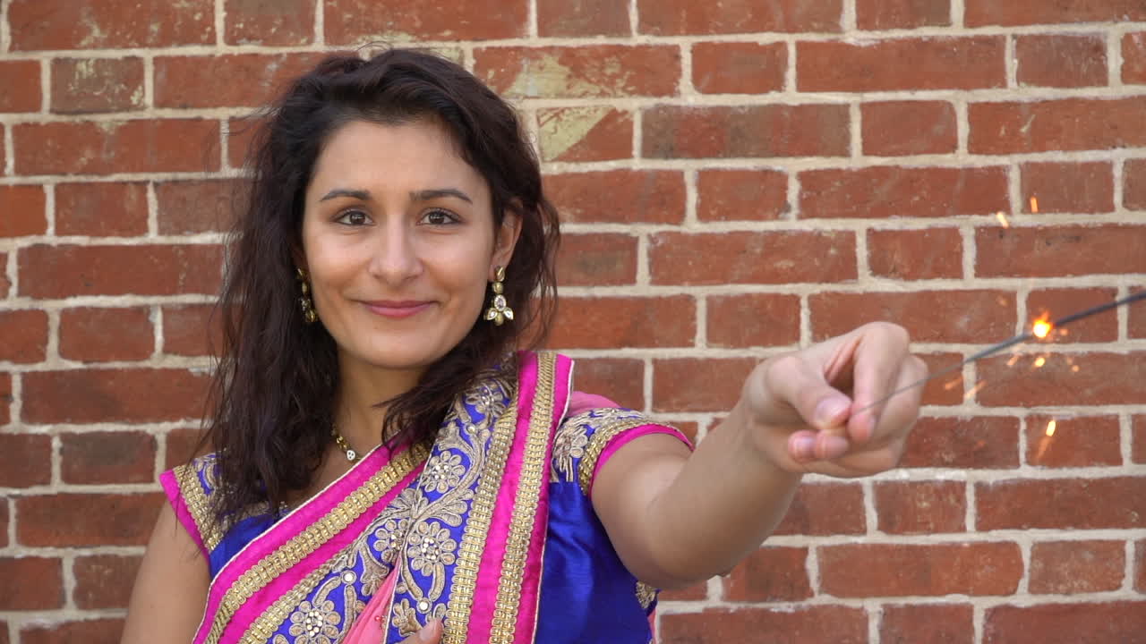 Girl In Traditional Dress With Fire Sparkle Cracker Celebrate Diwali ...