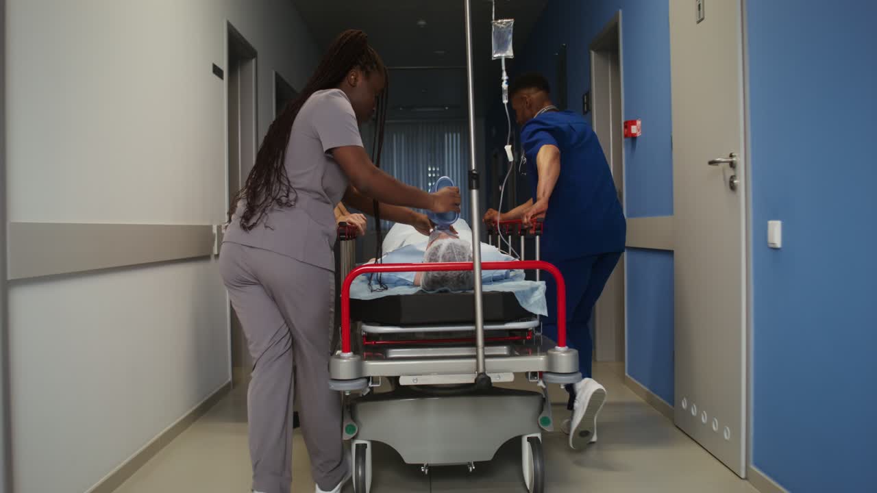 Hospital Staff Moving Patient on Stretcher | Premium Stock Video Footage