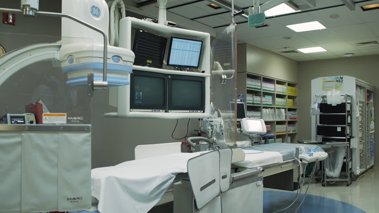Premium stock video - Tilt down to reveal hospital cath lab - slow ...