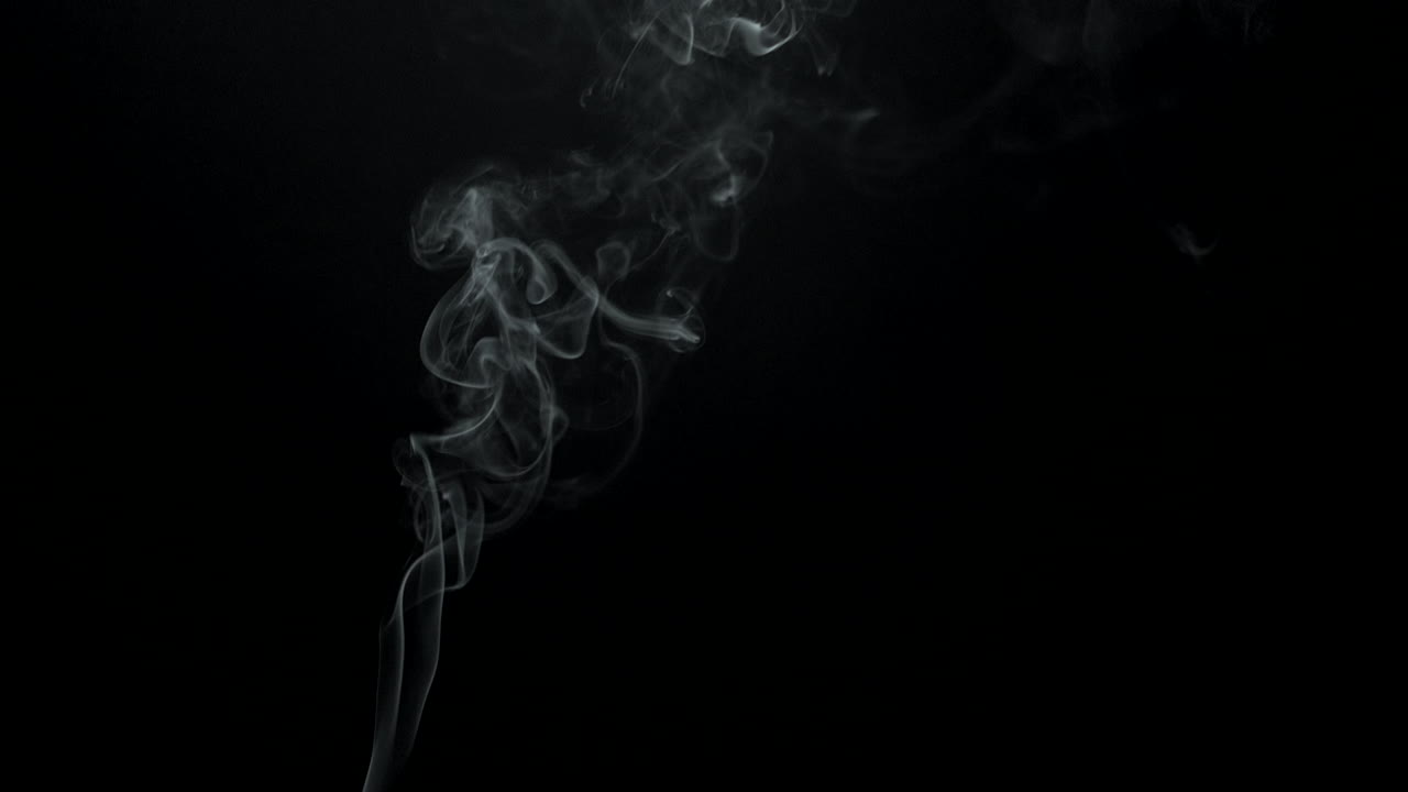 Premium stock video - Moke comes from bottom in background black slow ...