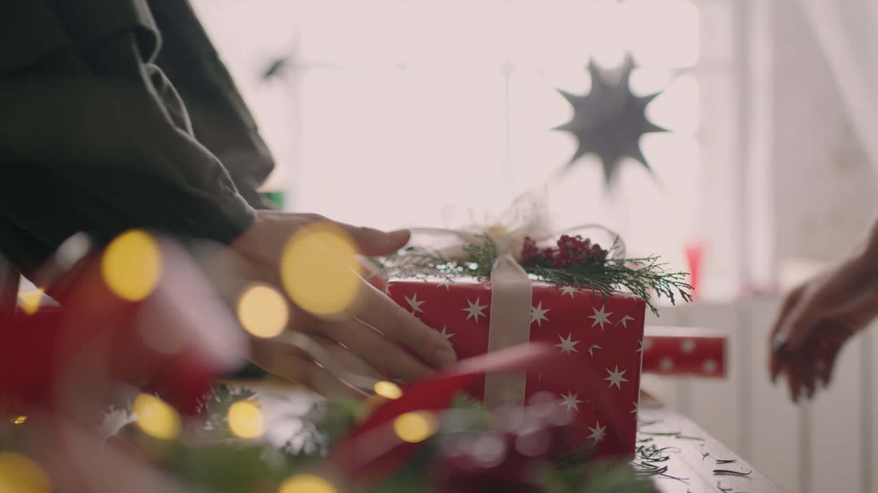 Premium stock video - Close-up of passing a gift from hand to hand. to ...
