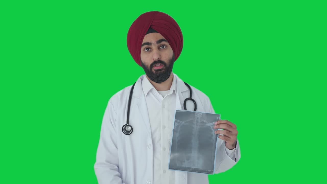 Premium stock video - Sad sikh indian doctor explaining x ray report to ...