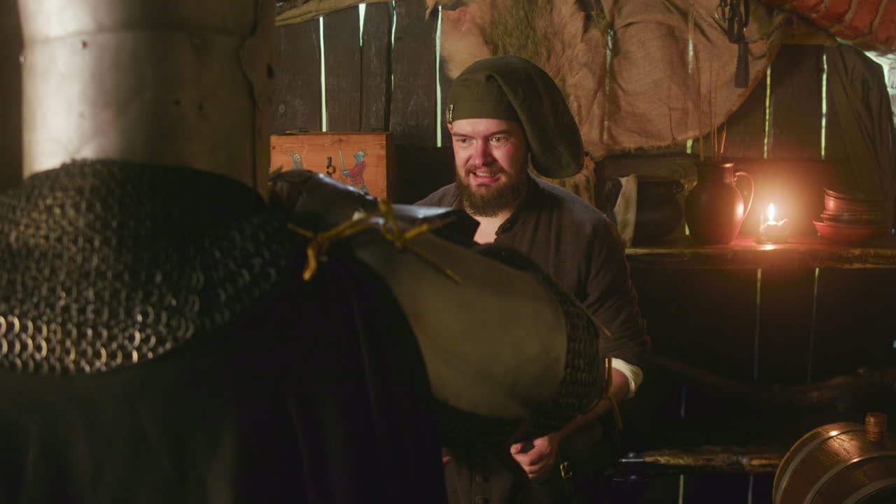 Bartender looks at drinking knight in tavern. fawning public house ...