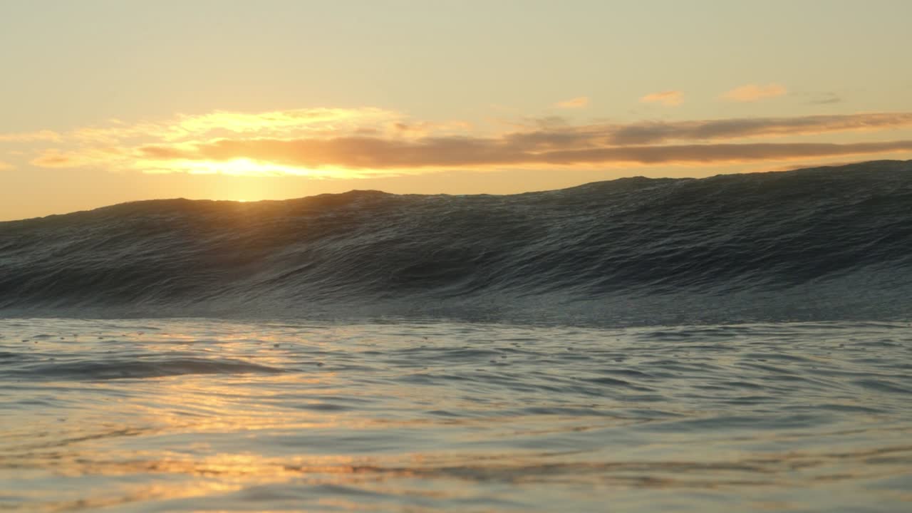 Premium stock video - The golden glow of the rising sun as a short ...