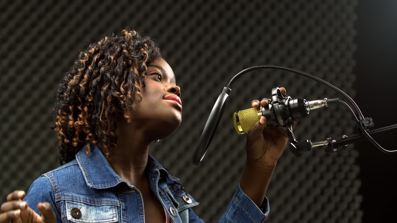 Premium stock video - African american alfro hair black woman sing a ...