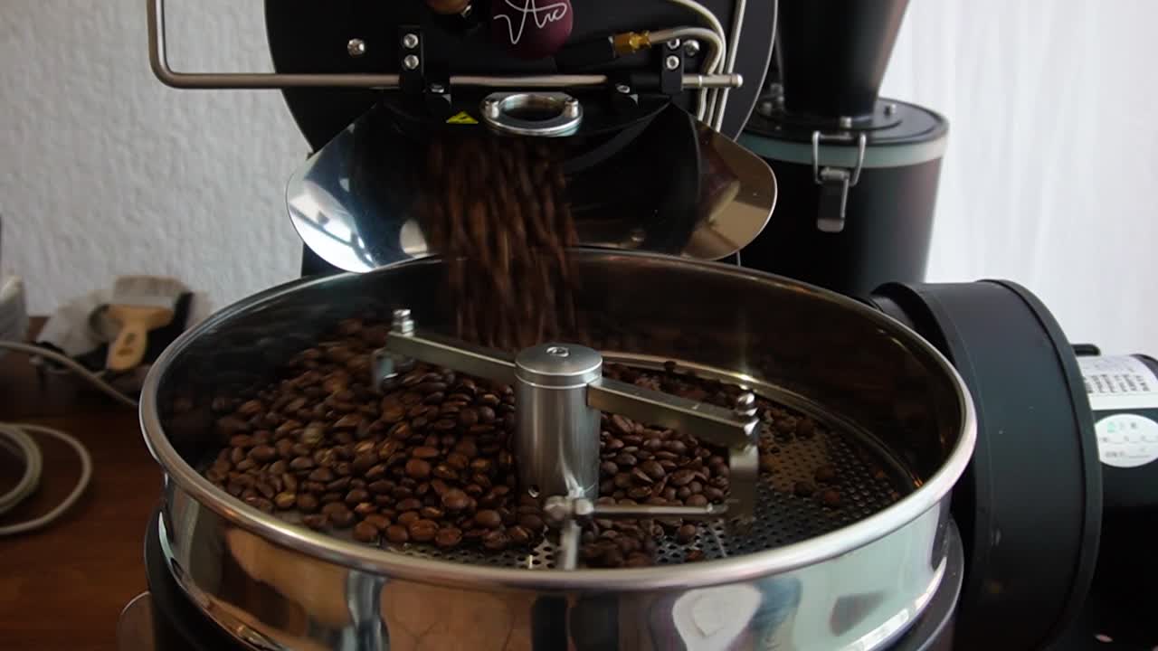 Premium stock video - Slow motion shot of process of roasting freshly ...
