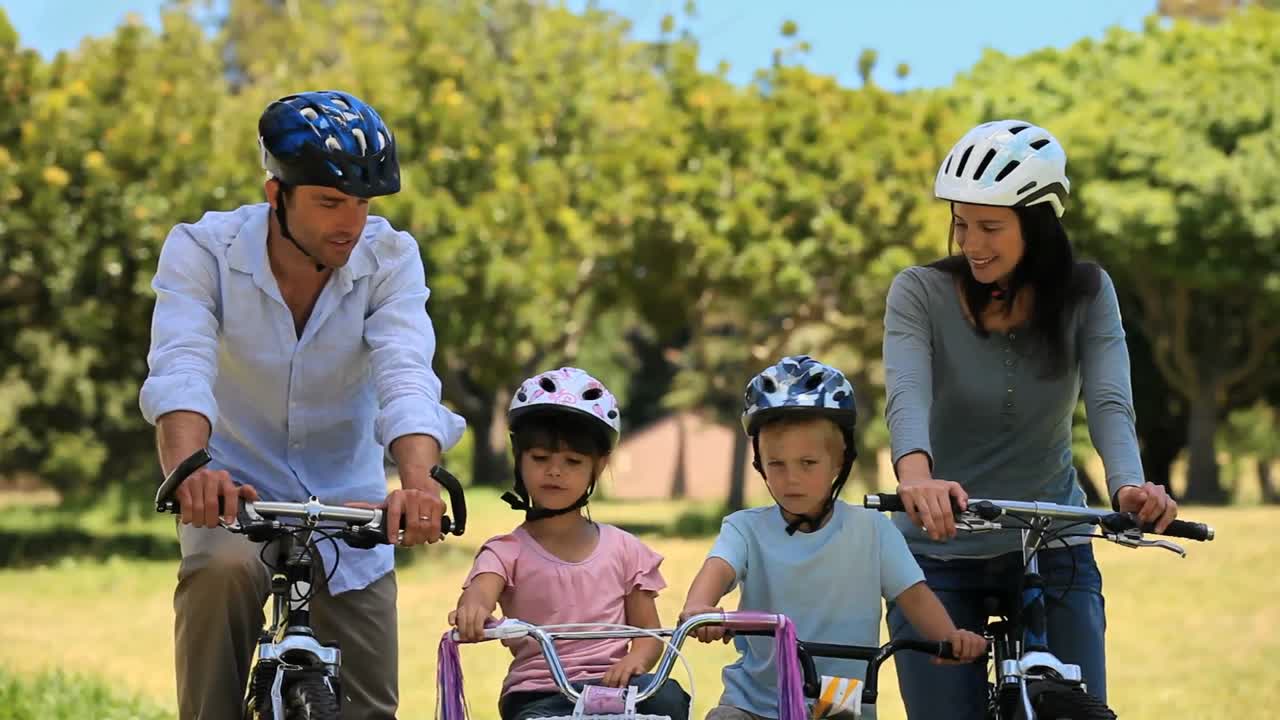 Family biking together Premium Stock Video Footage