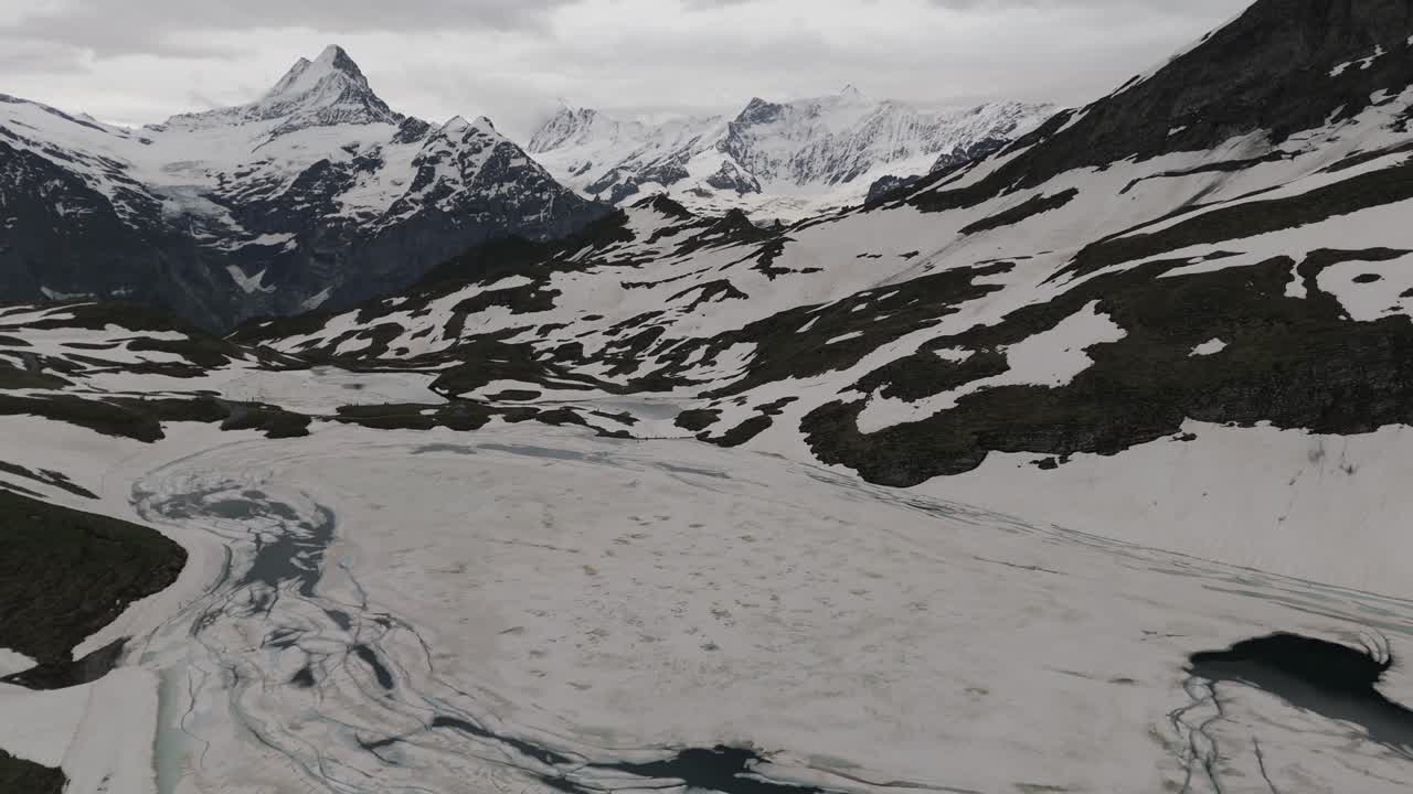 Aerial Establishing View Of Ice And Snow Covered Bachalpsee Lake ...