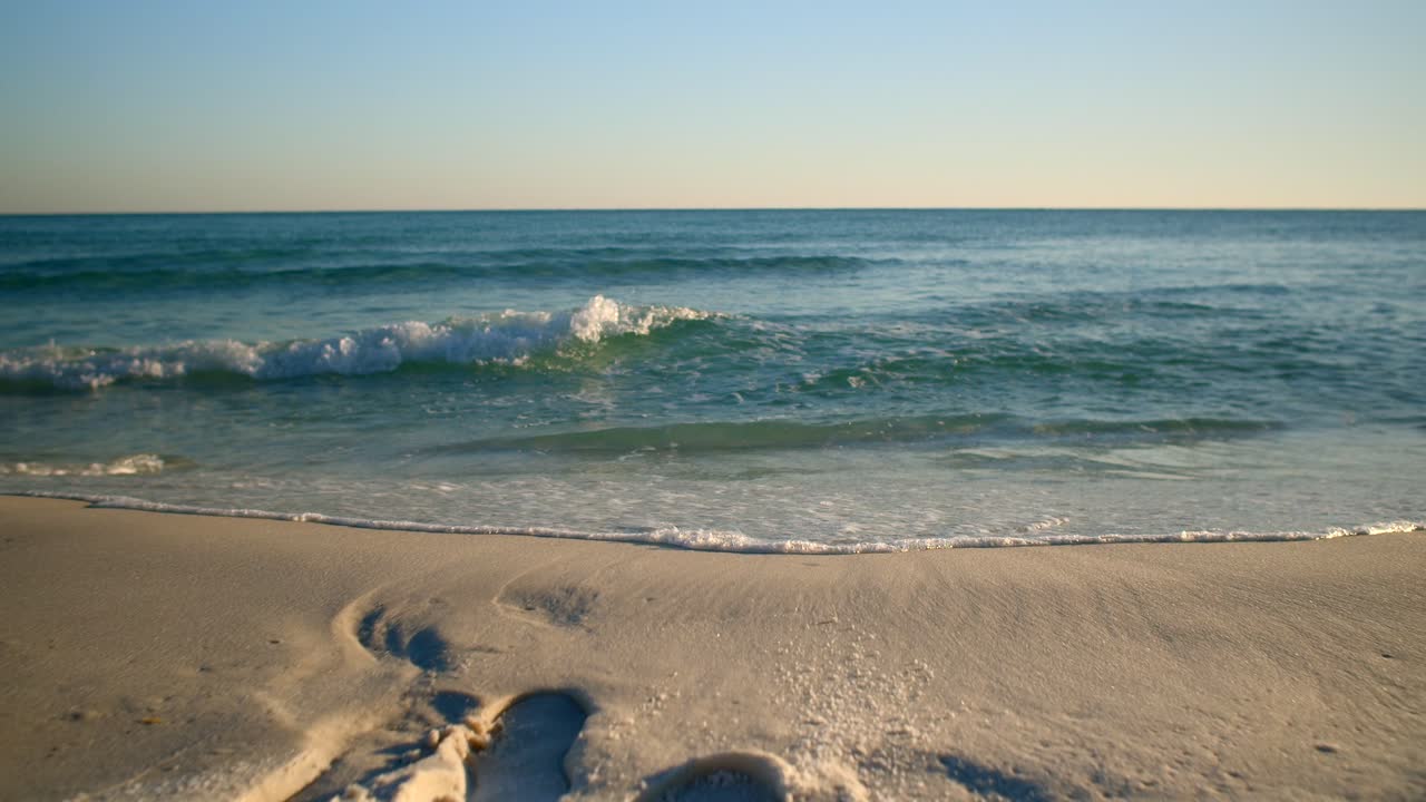 Premium stock video - Breakwater waves at sunset in gulf shores, alabama-1