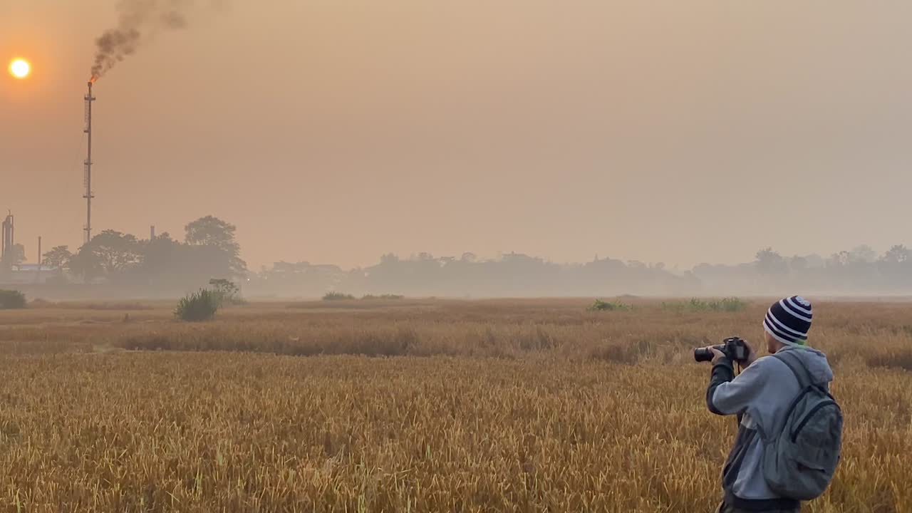 Photographer With Camera Documenting Polluted Area Near Gas Burning ...