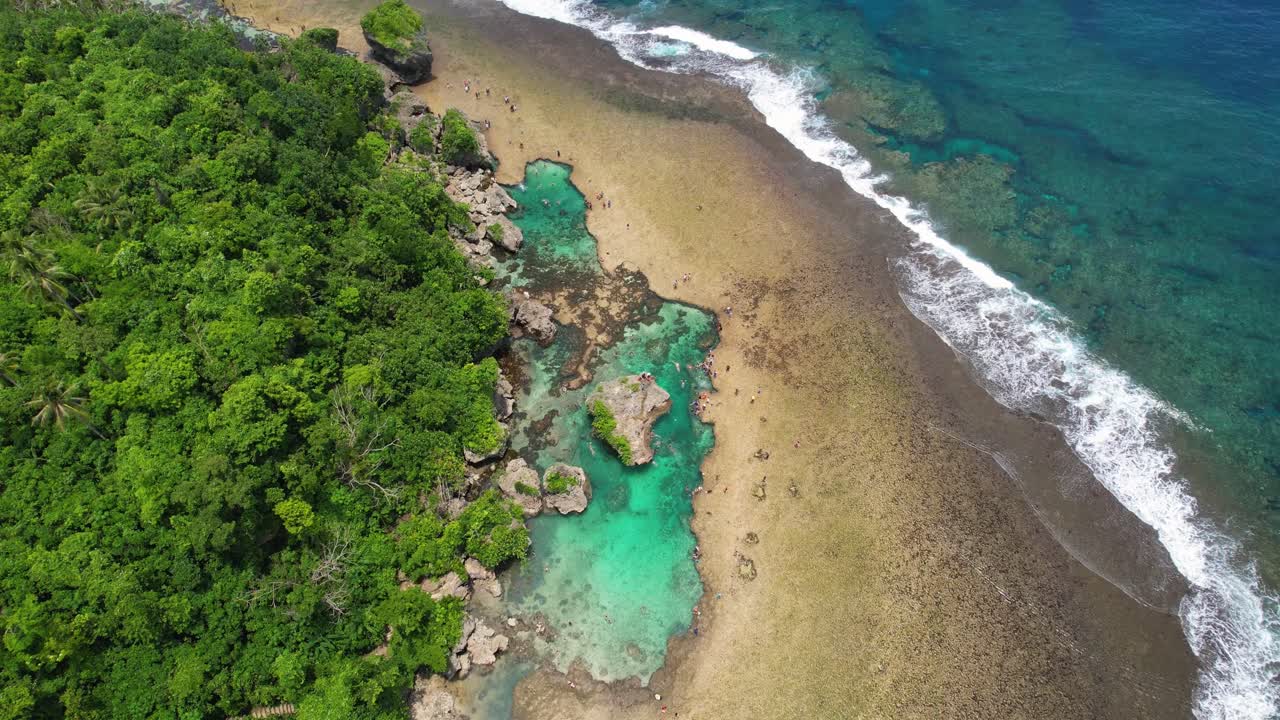 4k drone video over the magpupungko rock pools on siargao island in the ...