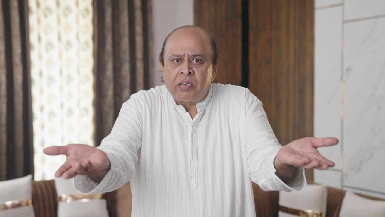 Premium stock video - Indian old man asking questions and diverting ...
