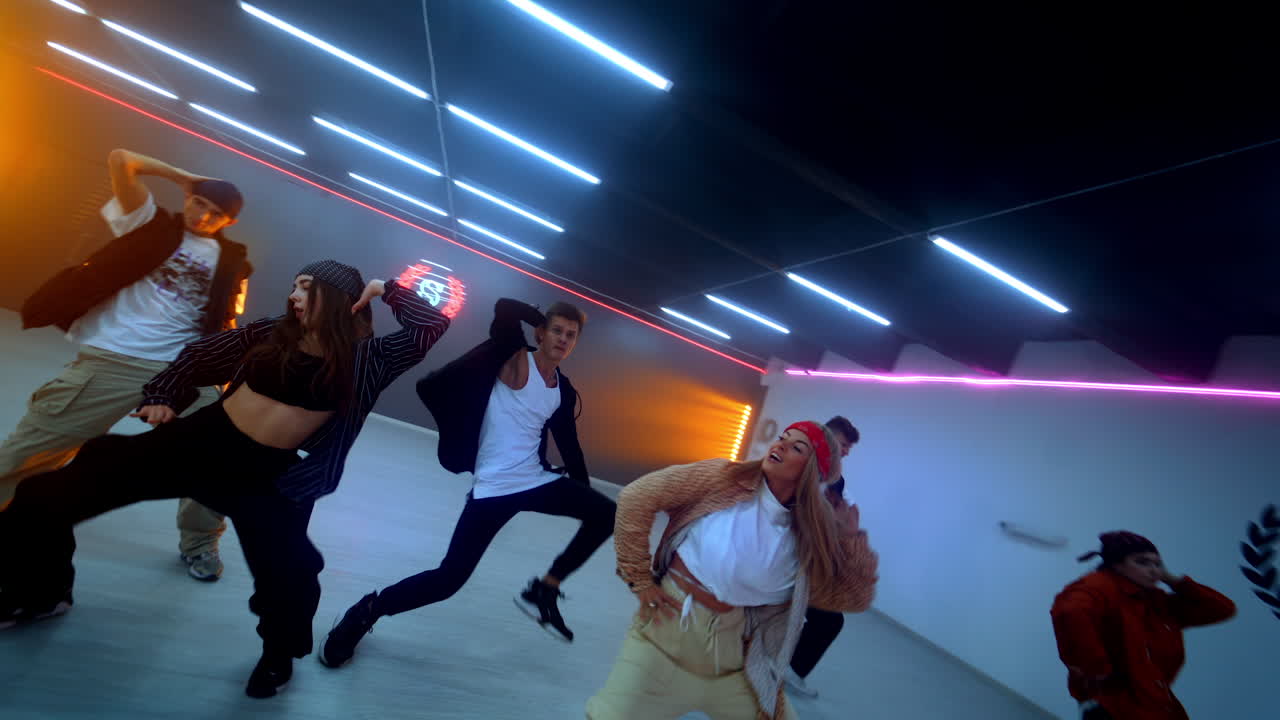 Energetic Dance Crew Performance in Neon Lit Studio | Premium Stock ...