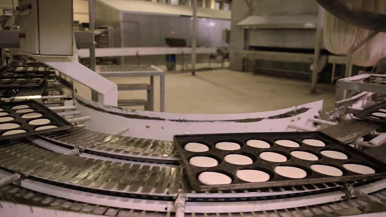 Premium stock video - Time-lapse of trays of dough transferred ...
