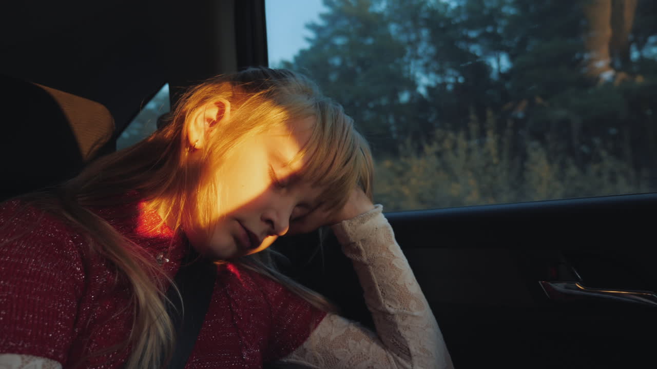 Child Passenger Dozing In The Back Seat Of A Car Free Stock Video ...