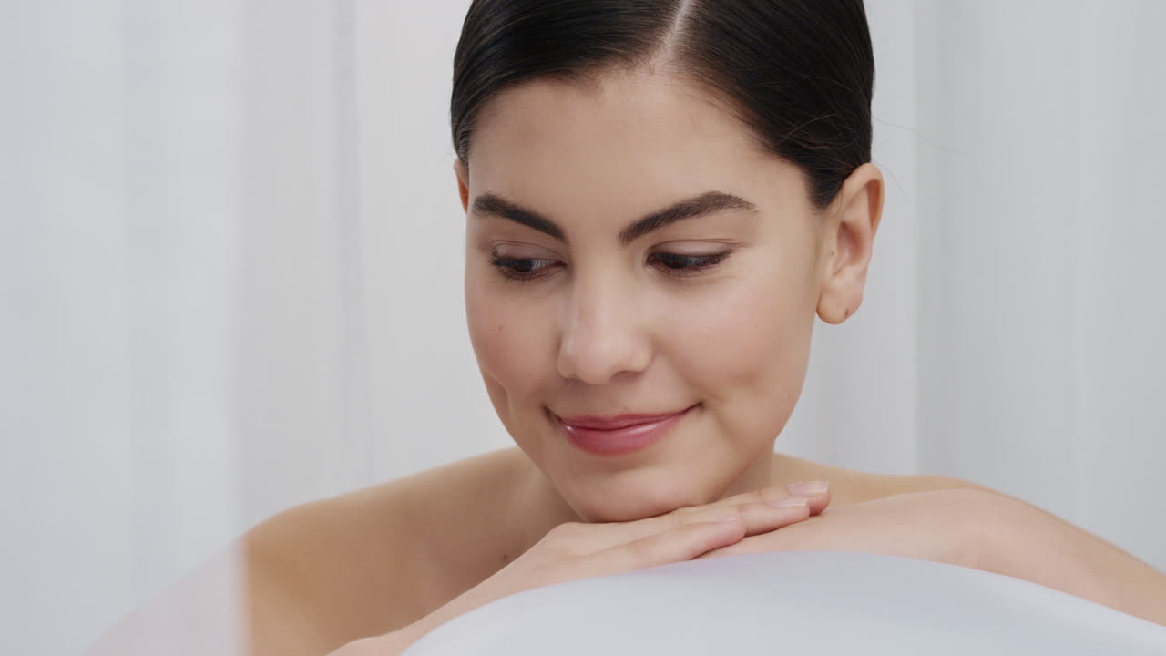 Premium stock video - Portrait attractive young woman with perfect skin ...