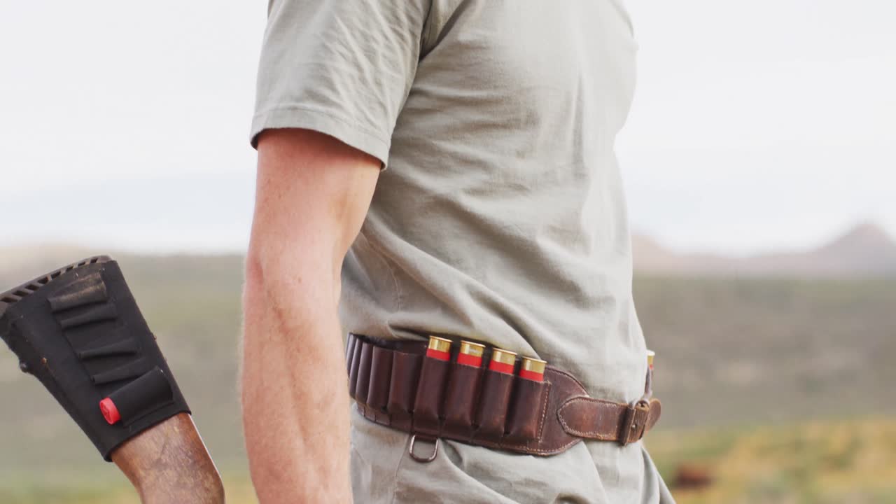 Premium stock video - Caucasian male survivalist holding hunting rifle ...