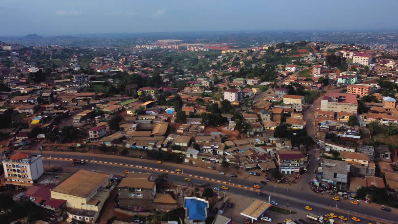 Aerial view of traffic and african homes in the emana district of ...