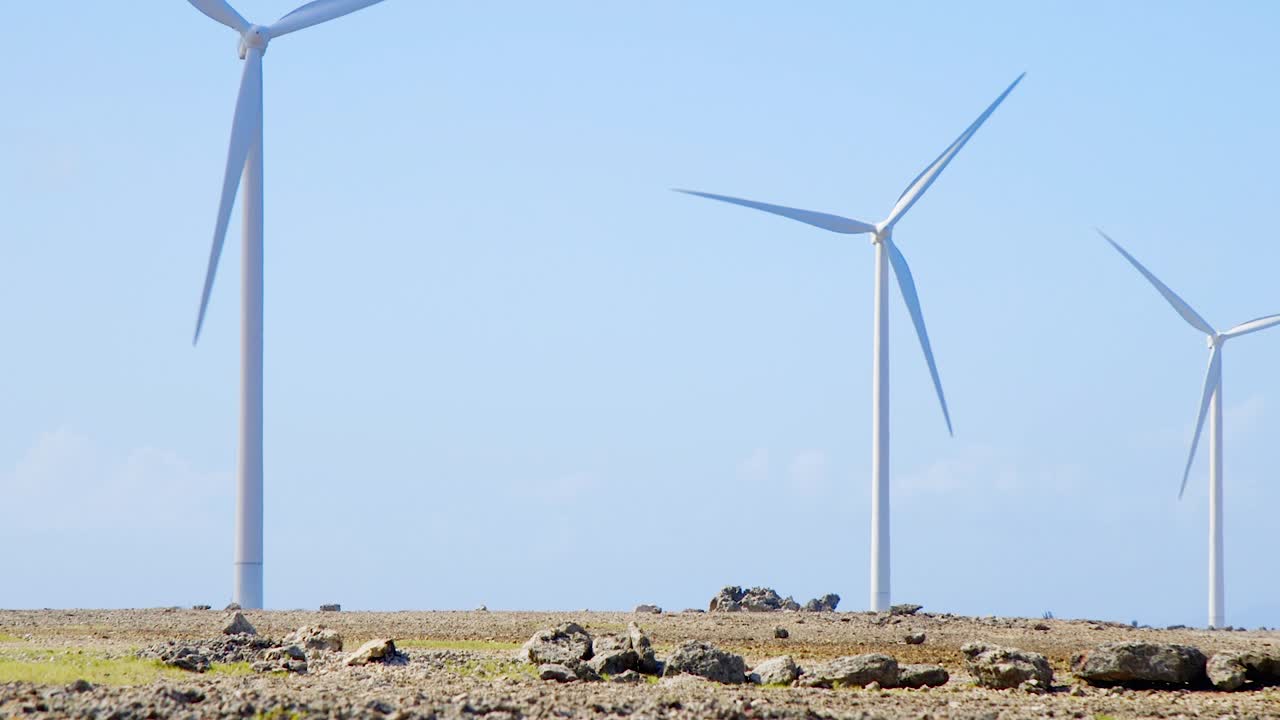 Premium stock video - Large wind turbines turning in the wind on the ...