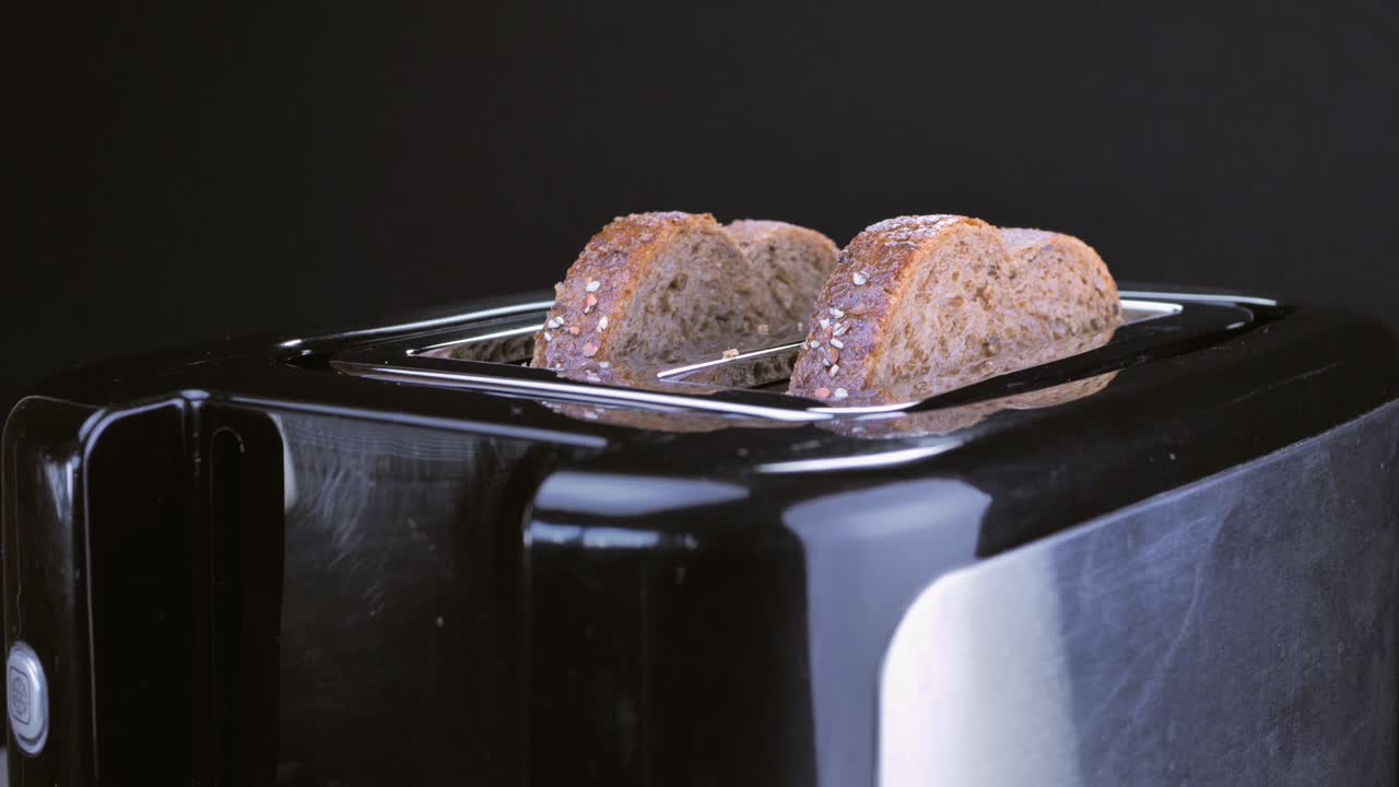 Roasted toast bread popping up from toaster Premium Stock Video Footage