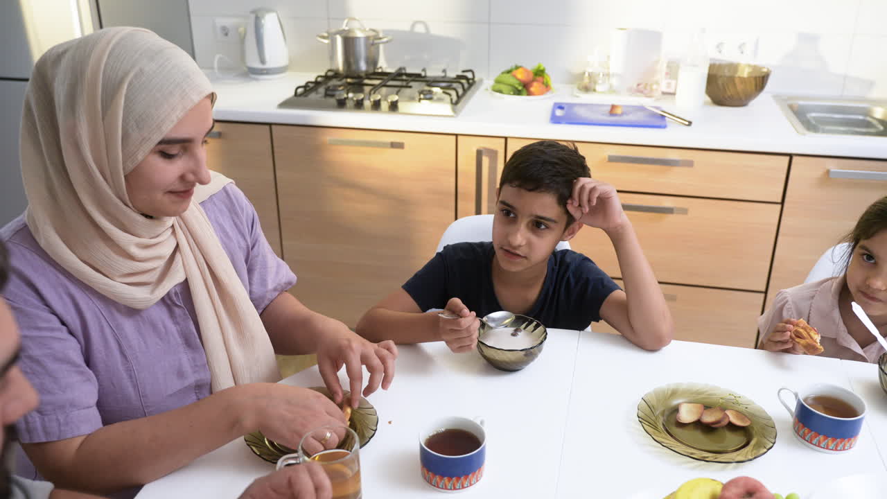Top view of Islamic family having breakfast. | Free Stock Video Footage
